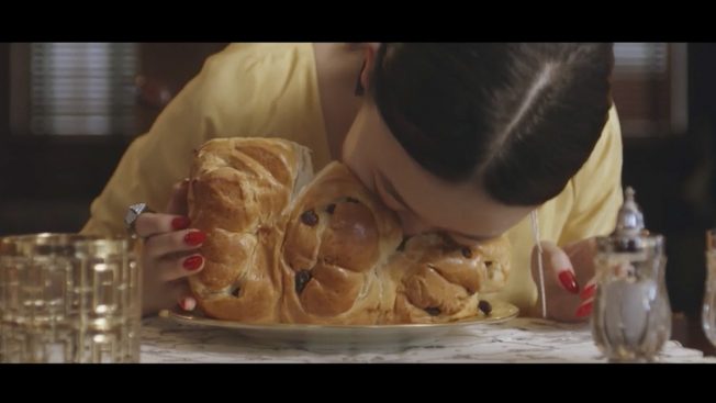 Bread Face Made an Ad for Jewelry While Mashing Her Face Into Baked Goods